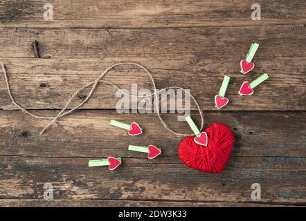 Decorative heart on rope, on wooden background Stock Photo - Alamy