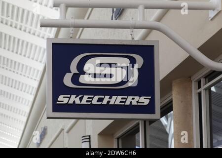 Skechers retail storefront with brand logo beneath fire escapes on ...