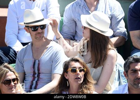 Calogero and his wife attending a French tennis Open semi-final match ...