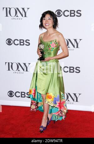 Linda Cho poses in the press room with her award for best costume ...