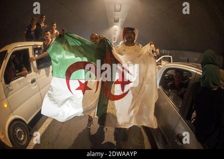 Soccer fans celebrate in Algiers, on June 26, 2014 after Algeria ...