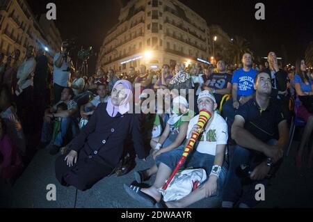 Soccer fans celebrate in Algiers, on June 26, 2014 after Algeria ...
