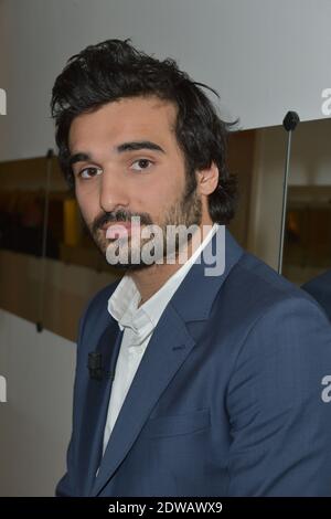 Syrus Shahidi at the taping of Vivement Dimanche on April 22, 2014 in ...