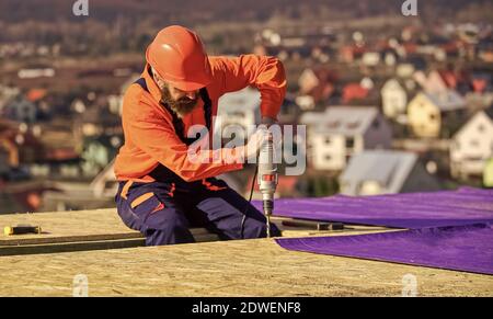 Master repair roof. Flat roof installation. Roofer constructing roof ...