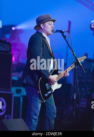 Lead singer and guitarist, Mark Chadwick of The Levellers performing at ...