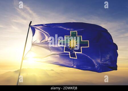 Puno of Peru flag waving on the top sunrise mist fog Stock Photo - Alamy