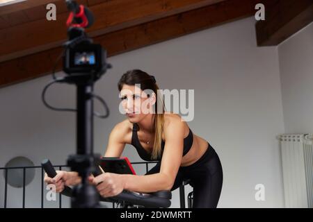 Vlogger recording spinning lesson Stock Photo - Alamy