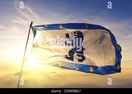 official flag of Siauliai County lithuania at cloudy sky background on ...