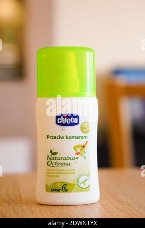 POZNAN, POLAND - Feb 28, 2016: Woman feeding young child with rice by a ...