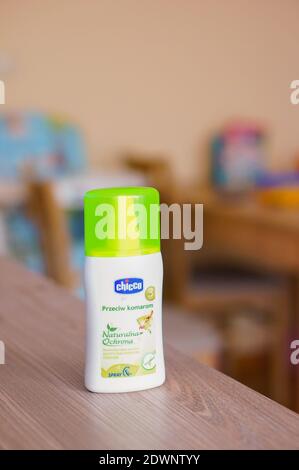 POZNAN, POLAND - Feb 28, 2016: Woman feeding young child with rice by a ...