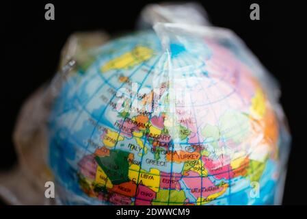 The planet earth is wrapped in plastic. Ecological disaster concept ...