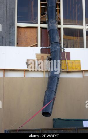 Demolition Chute at Building Construction Site in NYC Stock Photo - Alamy