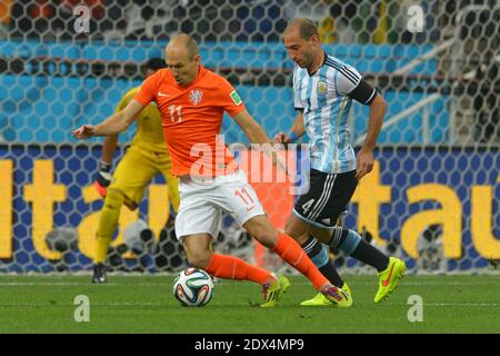 Netherlands's Arjen Robben battling Argentina's Javier Mascherano ...