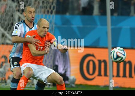 Netherlands's Arjen Robben battling Argentina's Javier Mascherano ...