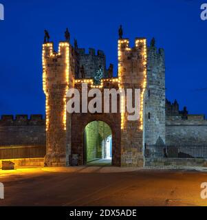 The Barbican at Alnwick Castle at dusk illuminated at Christmas ...