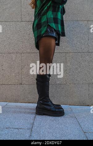 standing woman wearing fashionable boots Stock Photo - Alamy