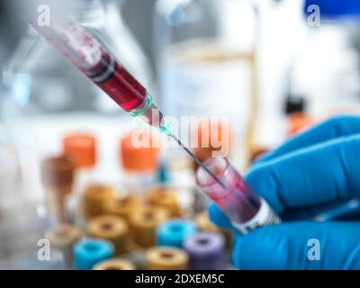 Scientist working with blood sample in laboratory Stock Photo - Alamy