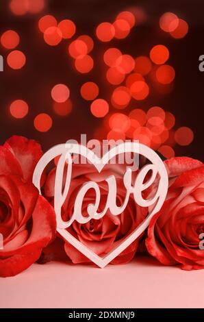 March 8 or Valentine's day. Romantic evening with red rose petals and ...