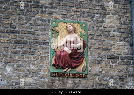 Traditional gable stone translated to The Faith Stock Photo - Alamy