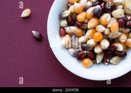 Multi Colored Popcorn Kernels in a Bowl Stock Photo - Alamy