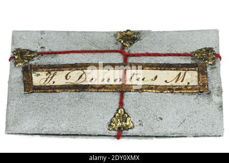 folded paper relic to Saint Donatus isolated on white background Stock ...