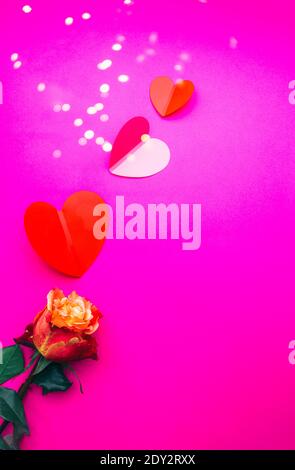 Paper origami hearts with beautiful rose flower on pink background ...