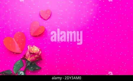 Paper origami hearts with beautiful rose flower on pink background ...