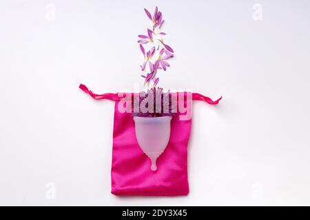 Menstrual cup with flowers on white background Stock Photo - Alamy