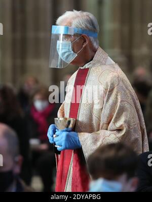 The Very Revd Robert Willis, Dean of Canterbury Cathedral, places a ...