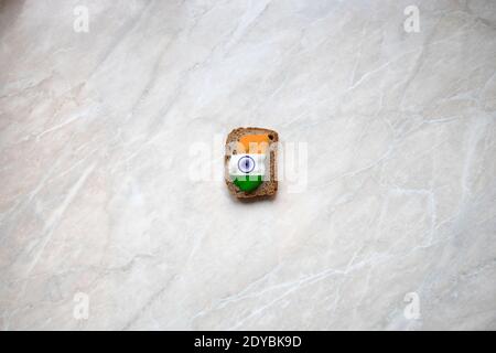 Business and politics concept. A crisis. Flag on the broken asphalt ...