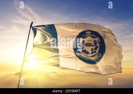 flag of Kitchener, Ontario , Canada at cloudy sky background on sunset ...