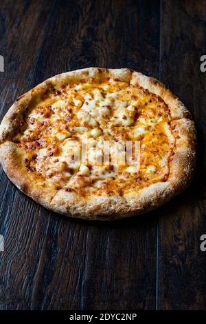 Pizza Quattro Formaggi Four Cheese Pizza on Wooden Surface. Ready to Eat Stock Photo - Alamy