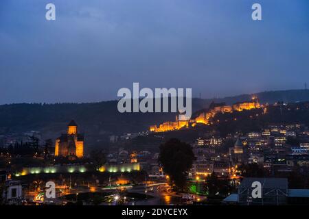 Metekhi cathedral and Narikala castle at foggy night as a one of the ...