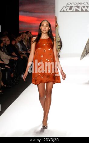 Models present Project Runway designer creations during the Season 11 ...