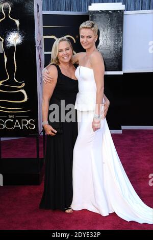 Charlize Theron and Gerda Maritz arriving at the 86th Academy Awards ...