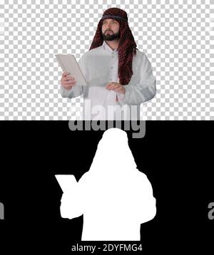 Sheikh using digital tablet and walking, Alpha Channel with Silh Stock ...