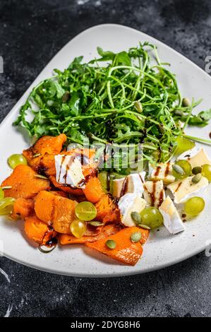 Grilled pumpking warm salad with arugula, walnuts and brie cheese ...