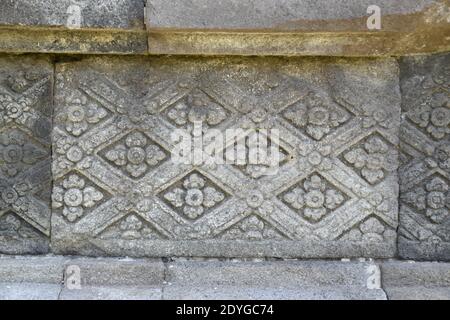 ancient art patterns at the main temple's wall in the Plaosan temple ...