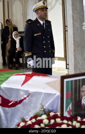 The coffin of Algeria's former head of state Ali Kafi draped in his ...
