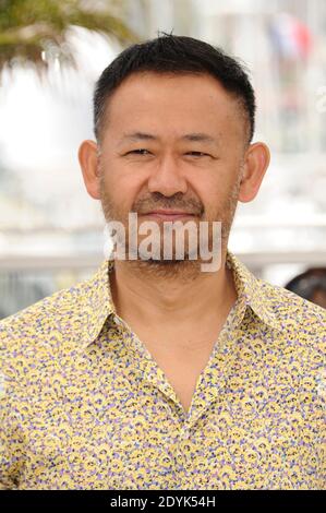 Jiang Wu posing at the 'Tian Zhu Ding' ('A Touch of Sin') photocall ...