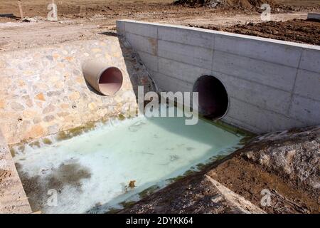 Two large diameter concrete pipes for a well Stock Photo - Alamy