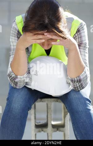 Sad construction worker Stock Photo - Alamy