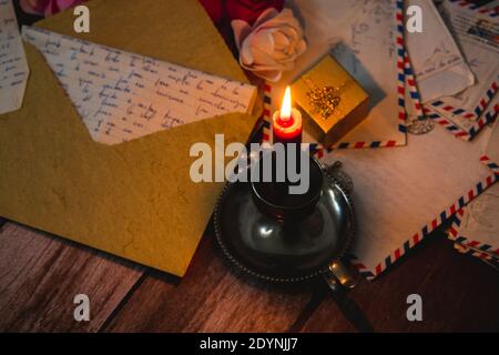 Envelopes, gift, candle and rose on light background. Valentine's Day ...