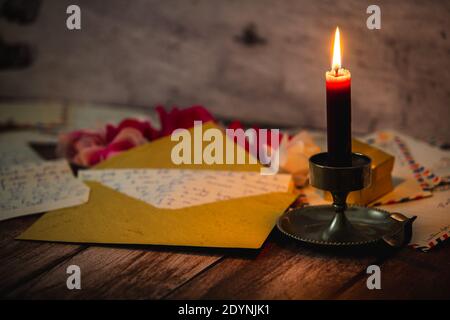 Envelopes, gift, candle and rose on light background. Valentine's Day ...