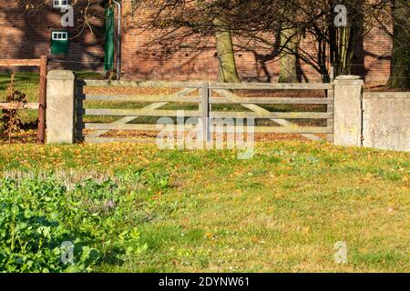 Closed wooden gate in a traditional Scandinavian roundpole fence ...