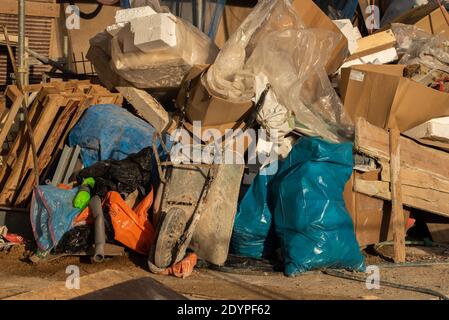 Rubbish from demolition. Wheelbarrow and rubbish. Construction site ...