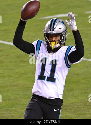 Carolina Panthers wide receiver Robby Anderson (11) gives a stiff-arm ...