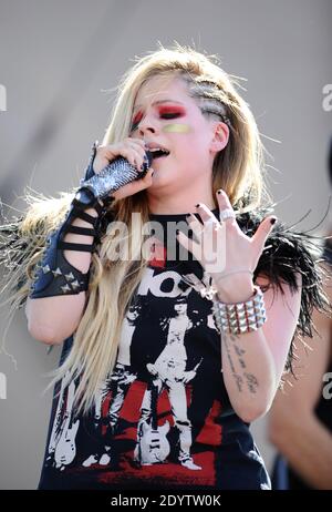 Avril Lavigne performs at the iHeart Village during the 2013 ...