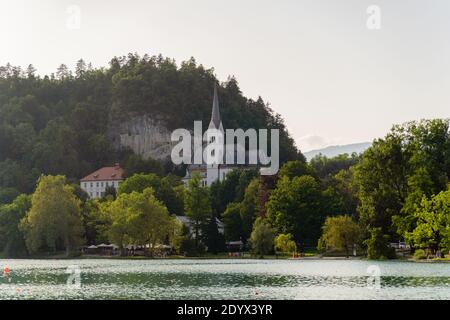 Mesmerizing shot of Lake Bled, Slovenia surrounded by forest mountains ...