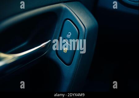 Car central door lock and unlock button close up. Close and open signs ...